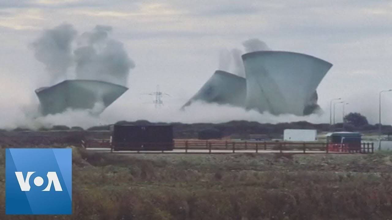 U.K. Cooling Towers Destroyed in Controlled Explosion - VOA | Vidio
